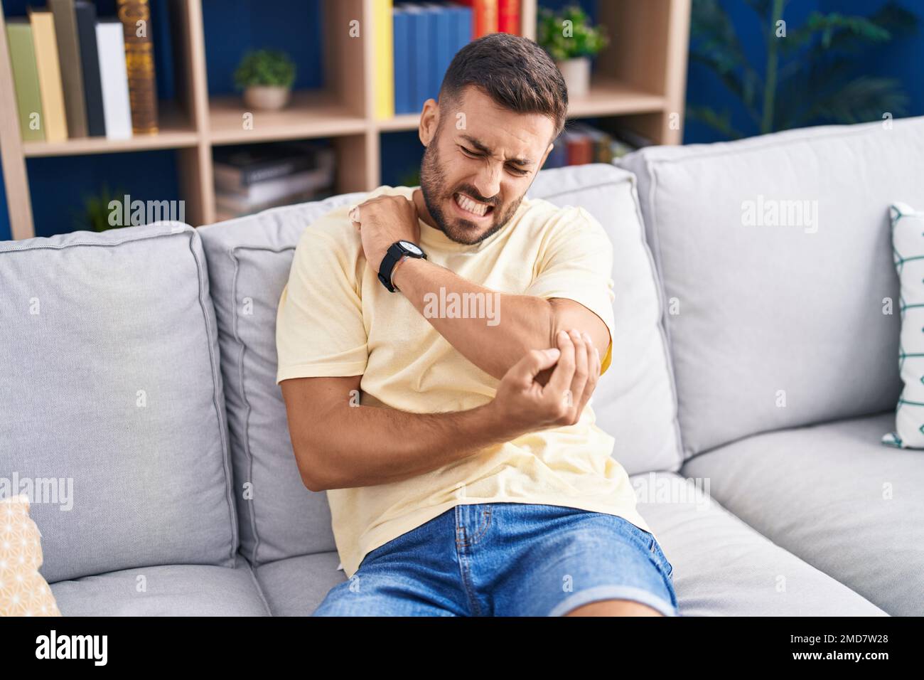 Elbow pain hispanic hi-res stock photography and images - Alamy
