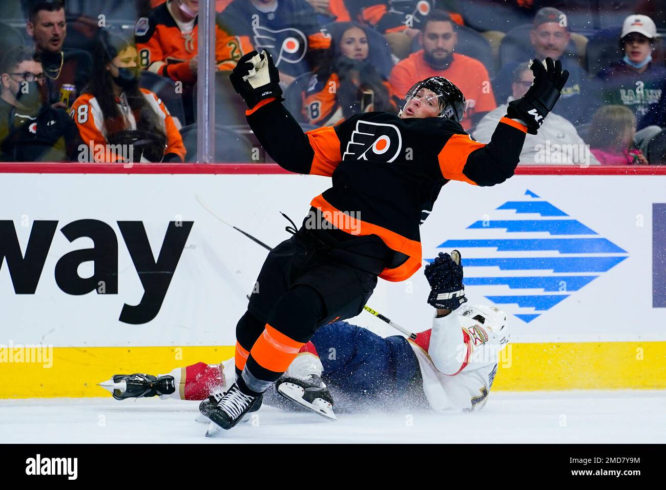 Philadelphia Flyers' Nick Seeler, top, collides with Florida Panthers ...