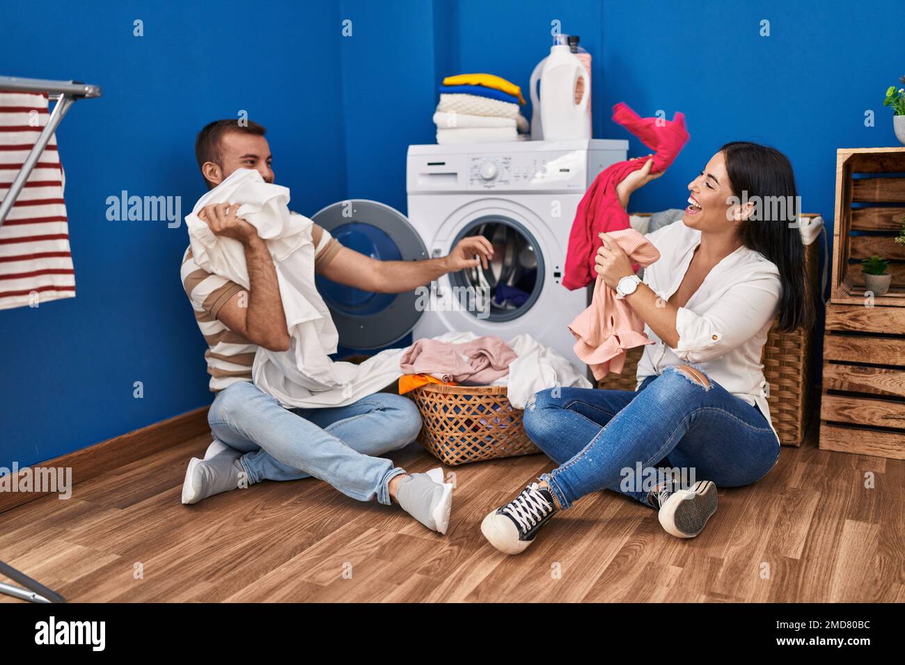 Young woman washing clothes playing hi-res stock photography and images ...
