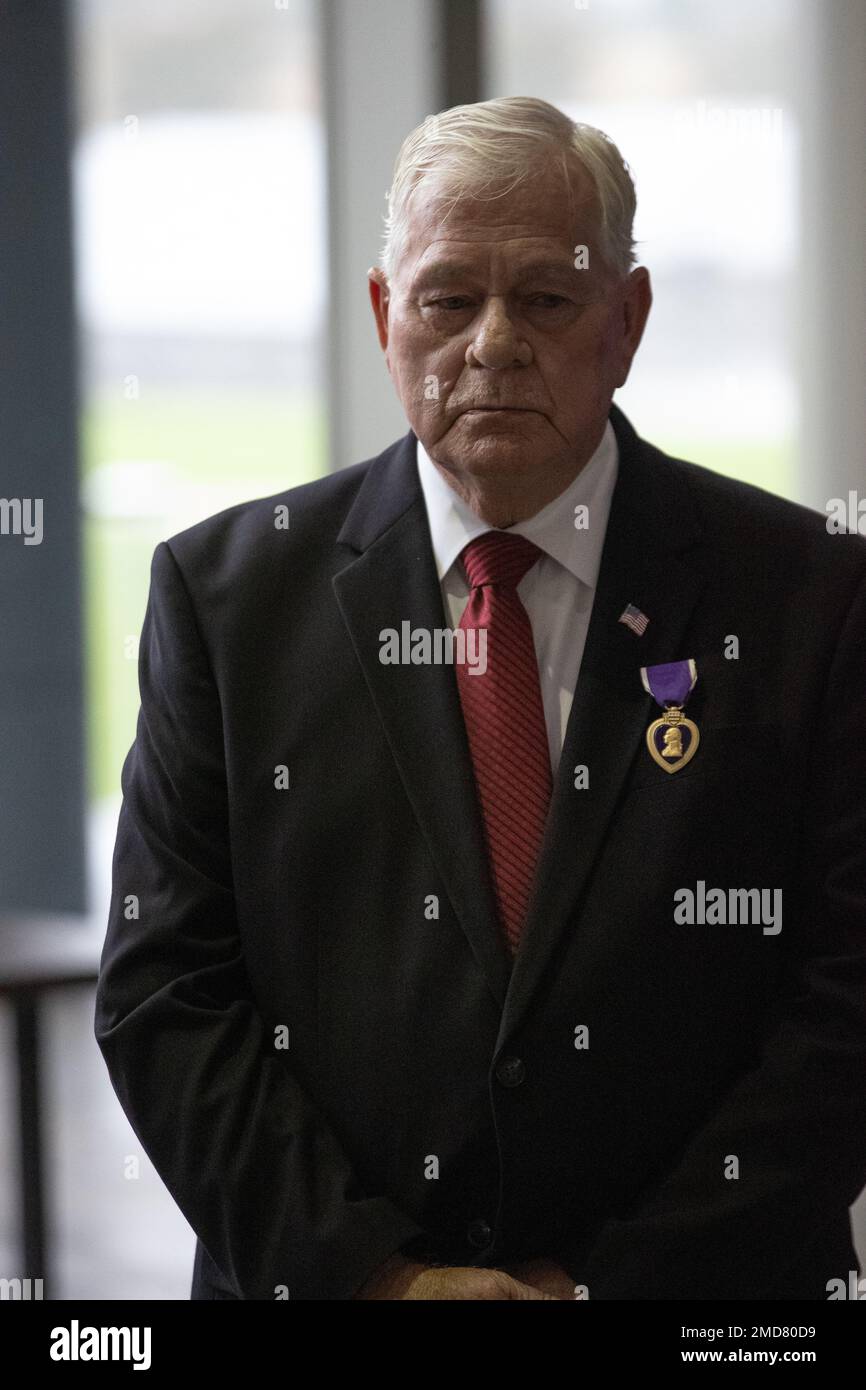 Retired Lt. Col. David Hartline is pinned with the Purple Heart metal ...