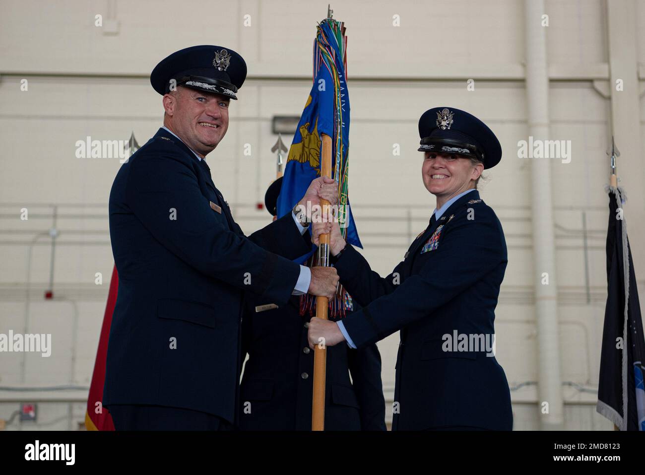 U.S. Air Force Col. Elizabeth Hanson receives a guidon from Maj. Gen ...