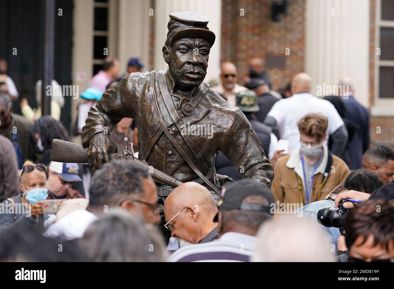 People view the statue honoring Black enslaved men who enlisted in the ...