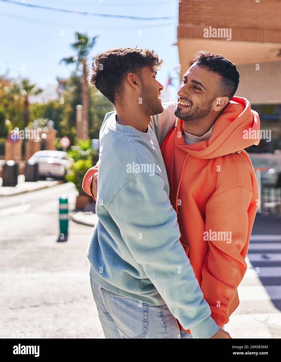 Two man couple smiling confident dancing at street Stock Photo - Alamy