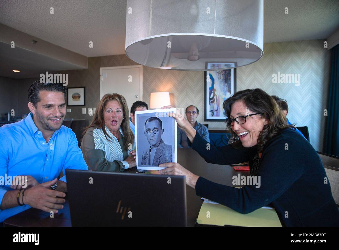 Anna Salton Eisen holds up a photo of Emil Ringel, father of Barbara ...