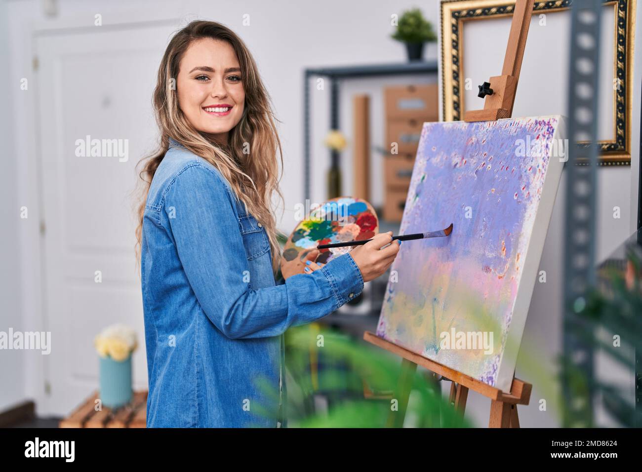 Young woman artist smiling confident drawing at art studio Stock Photo ...