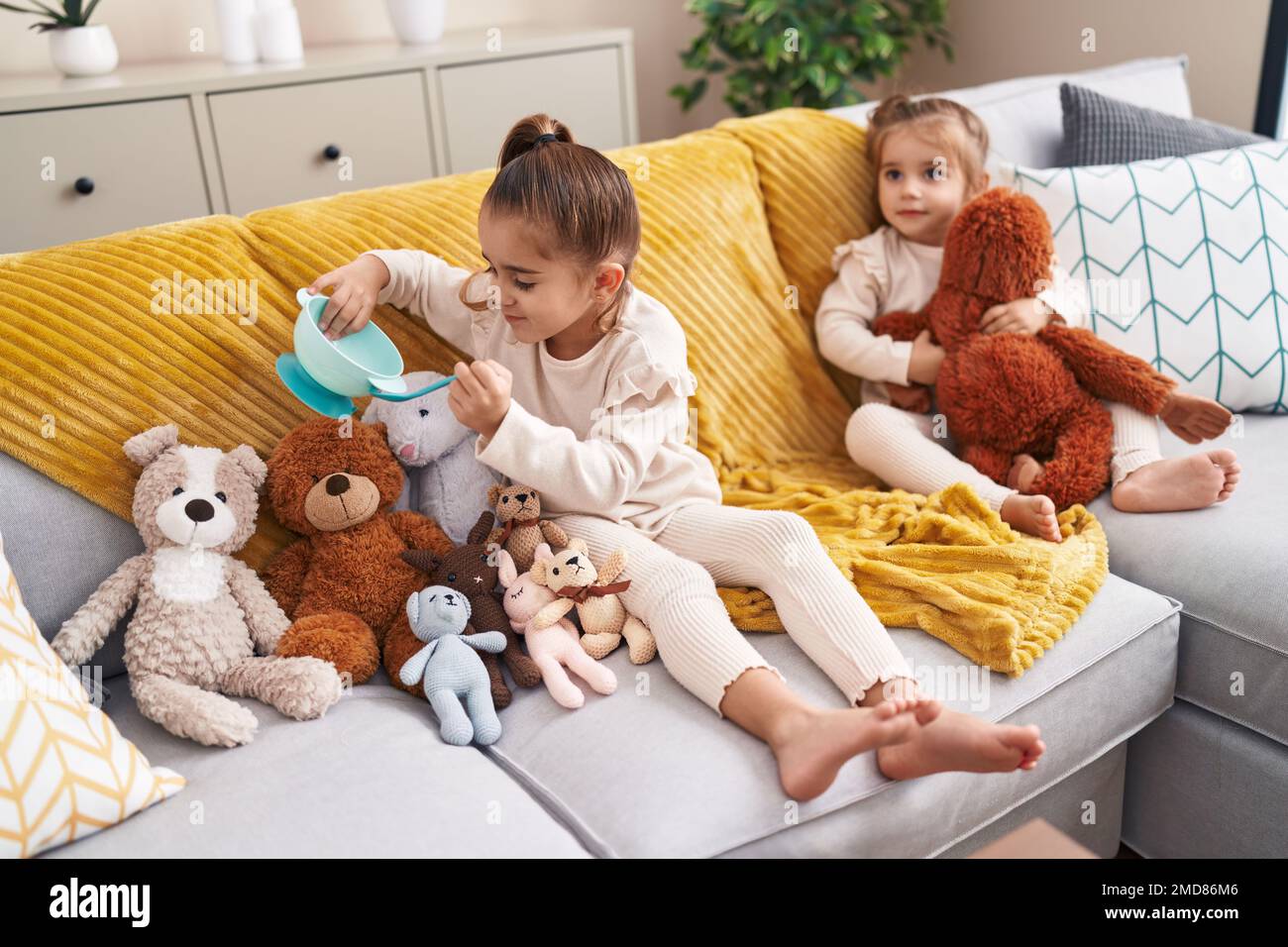 Boy girl playing dolls hi-res stock photography and images - Alamy