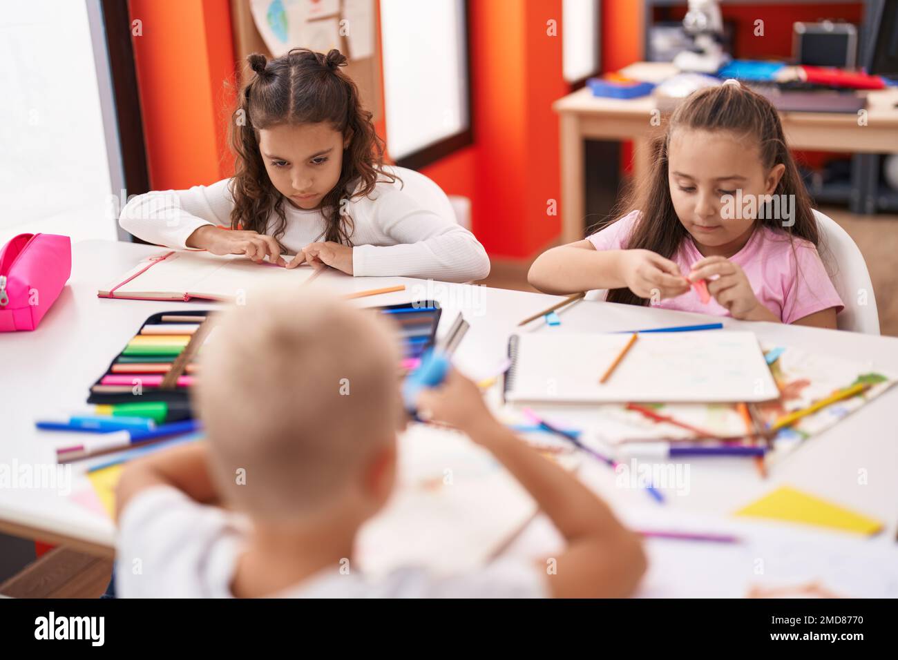 Group of kids preschool students sitting on table drawing on paper at ...