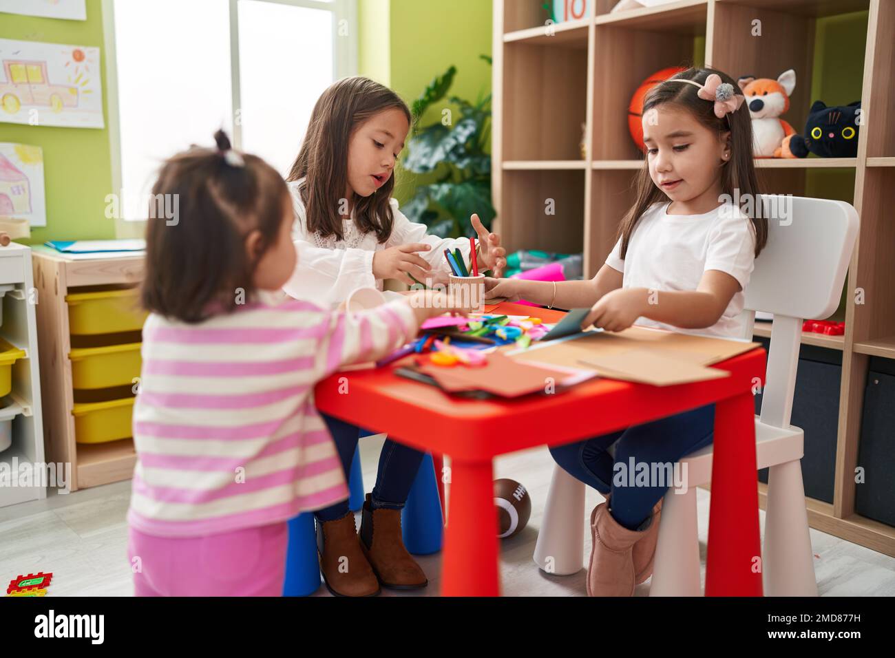 Group of kids preschool students sitting on table drawing and make ...