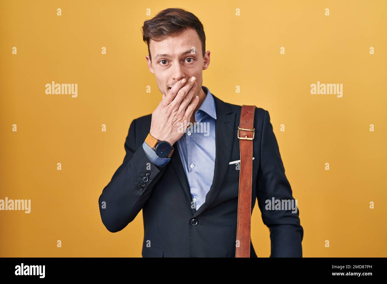 Caucasian business man over yellow background laughing and embarrassed ...