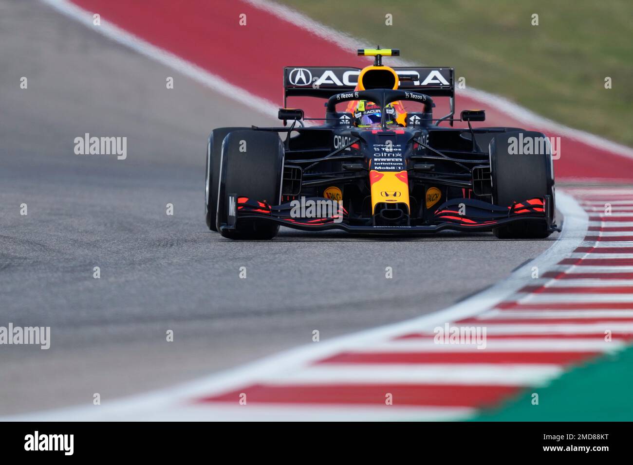 Red Bull driver Sergio Perez, of Mexico, drives into a turn during a practice session for the F1 ...