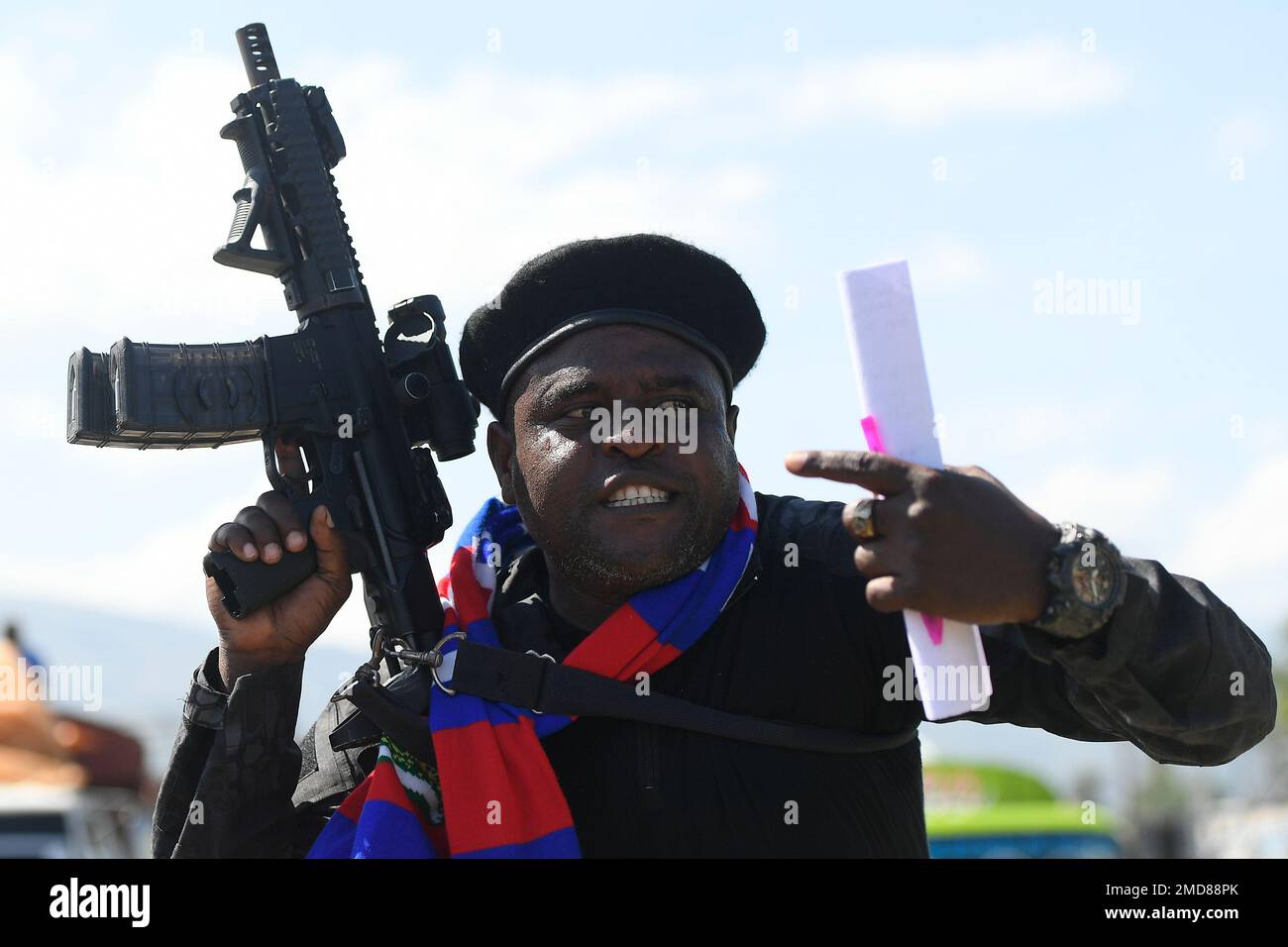 Barbecue, the leader of the "G9 and Family" gang, leads a march against ...