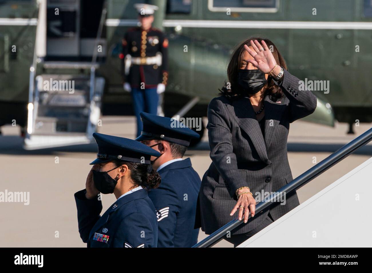Vice President Kamala Harris waves as she boards Air Force Two from ...