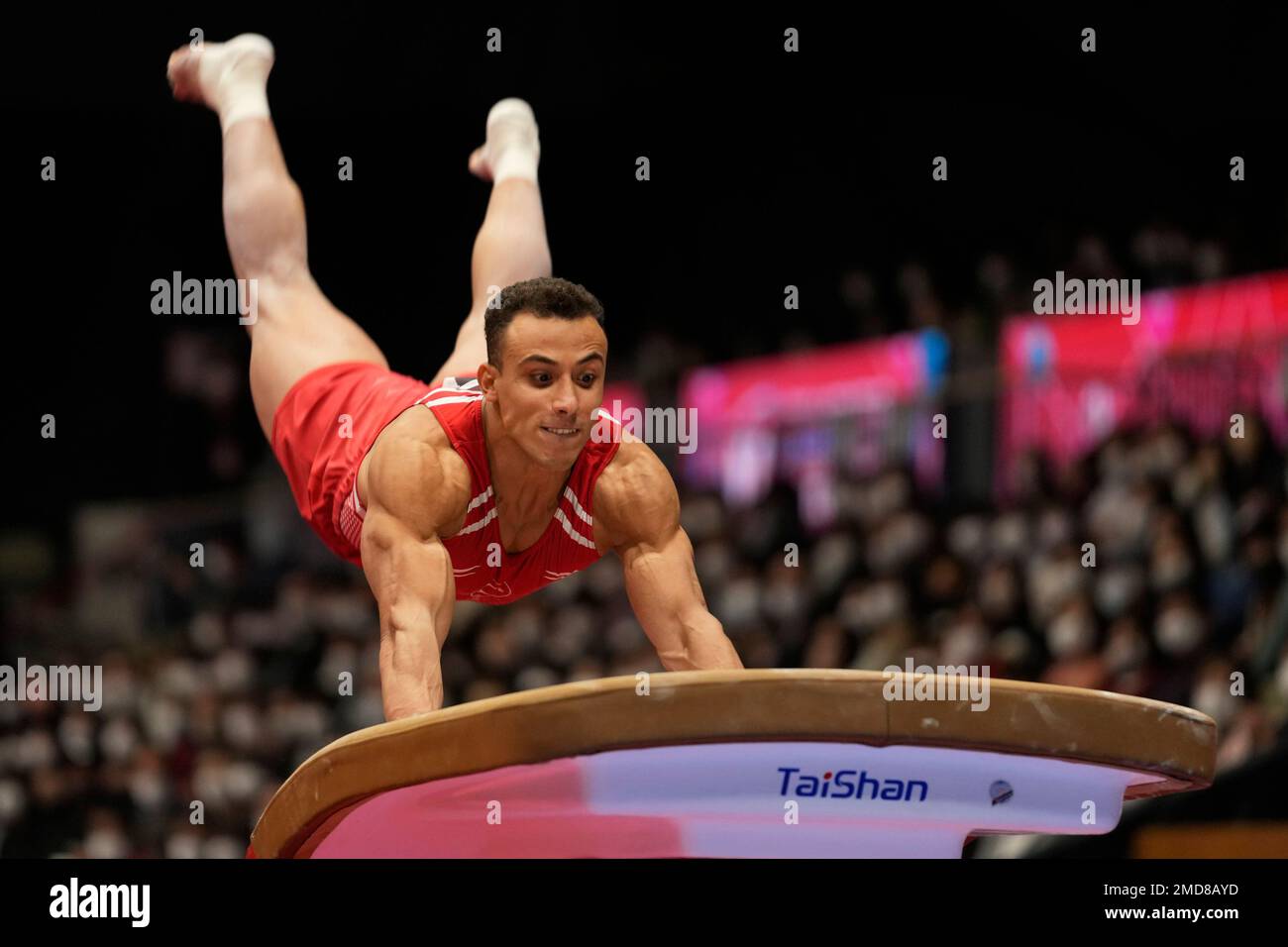 Adem Asil, of Turkey, competes on the vault during the men's all-around ...