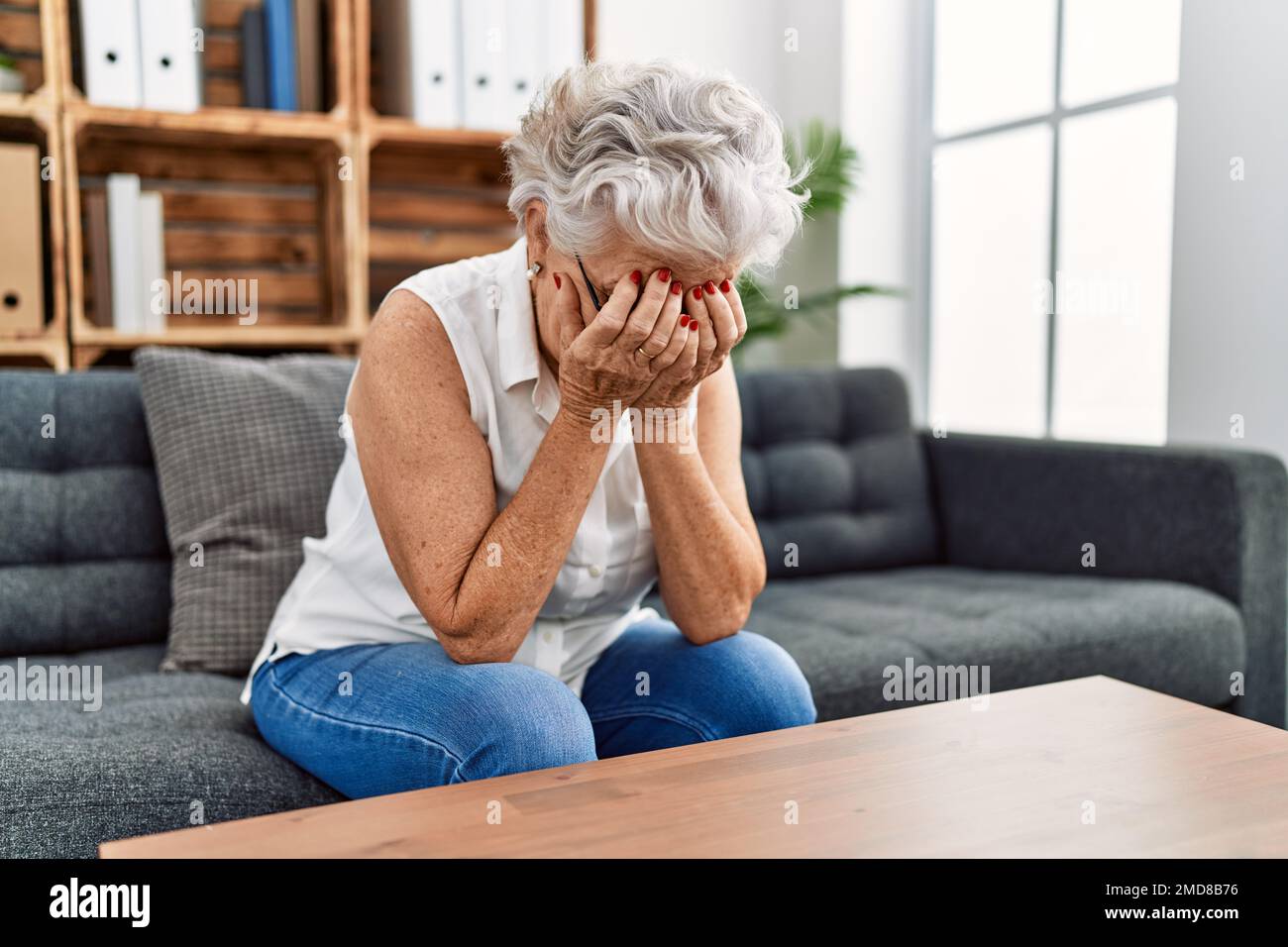 Senior grey-haired woman patient depressed at psychology center Stock ...