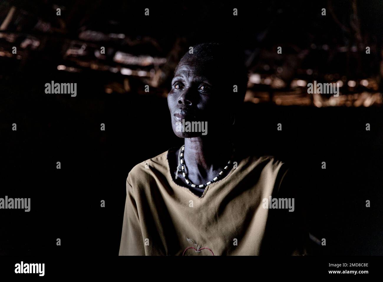 Ajou Bol Yel, who doesn't know her age, poses for a portrait in Langic ...