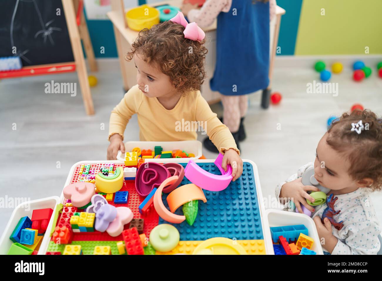 Group kids playing construction blocks hi-res stock photography and ...