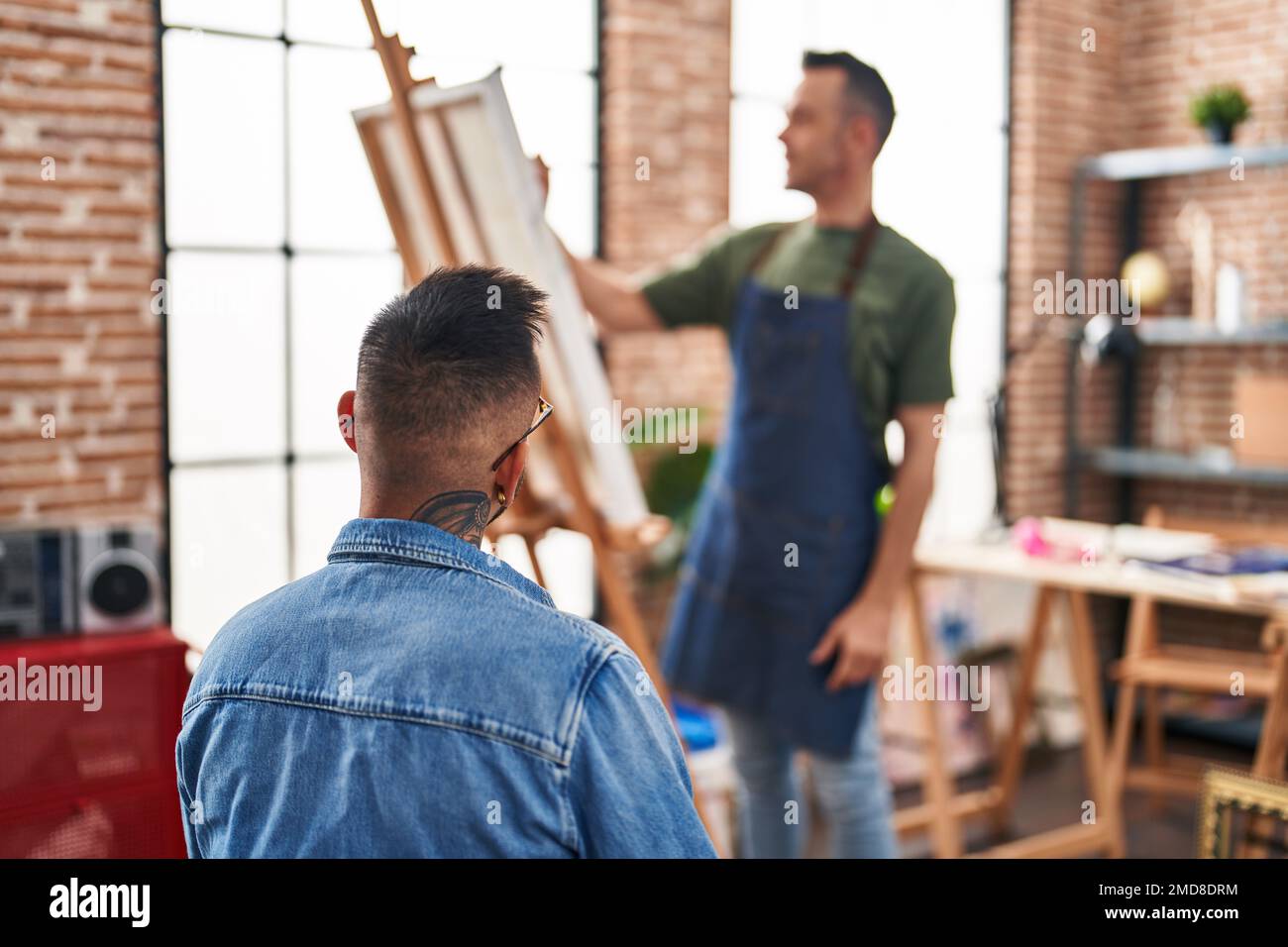 Two men artists drawing portrait at art studio Stock Photo - Alamy