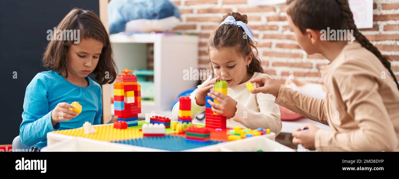 Group kids playing construction blocks hi-res stock photography and ...