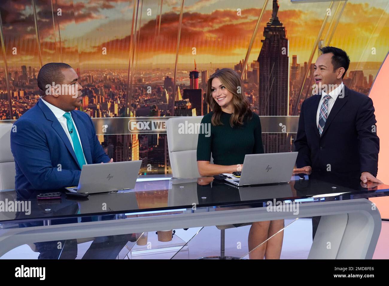 Fox Weather co-anchors and meteorologists Jason Frazer, left, Britta ...