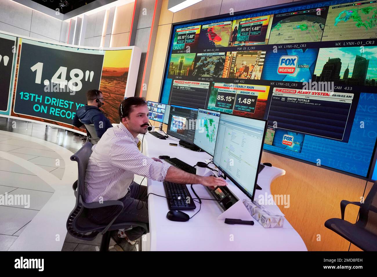 Fox Weather producer and meteorologist Geoff Bansen, rehearses on the ...