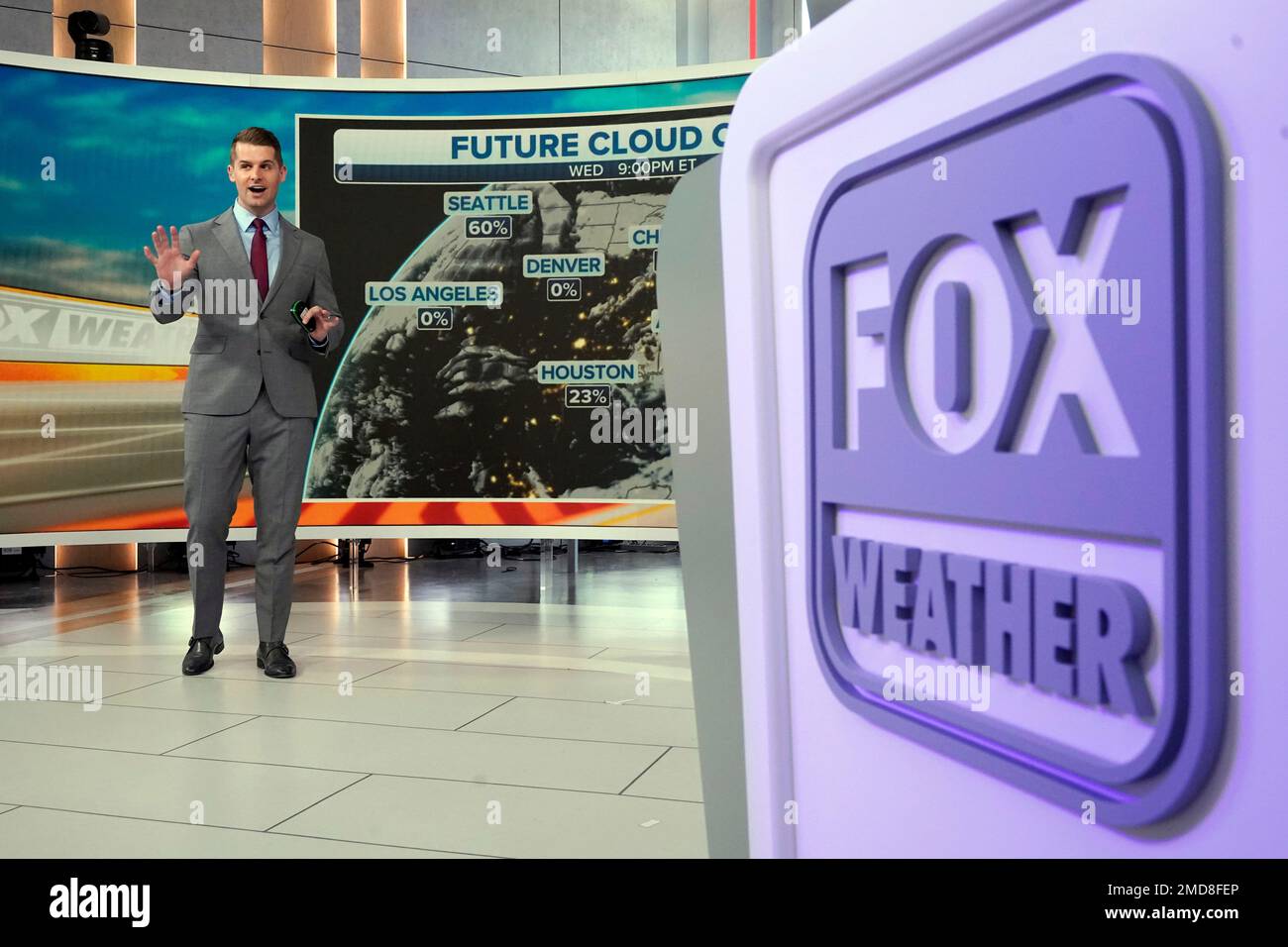 Fox Weather meteorologist Stephen Morgan rehearses on the Fox Weather ...