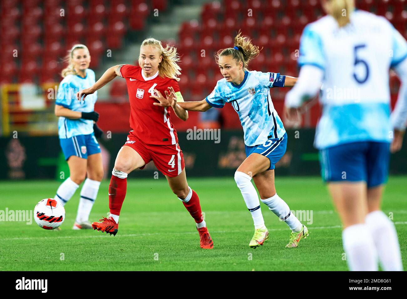 Poland's Paulina Dudek, left, is challenged by Norway's Caroline Graham ...
