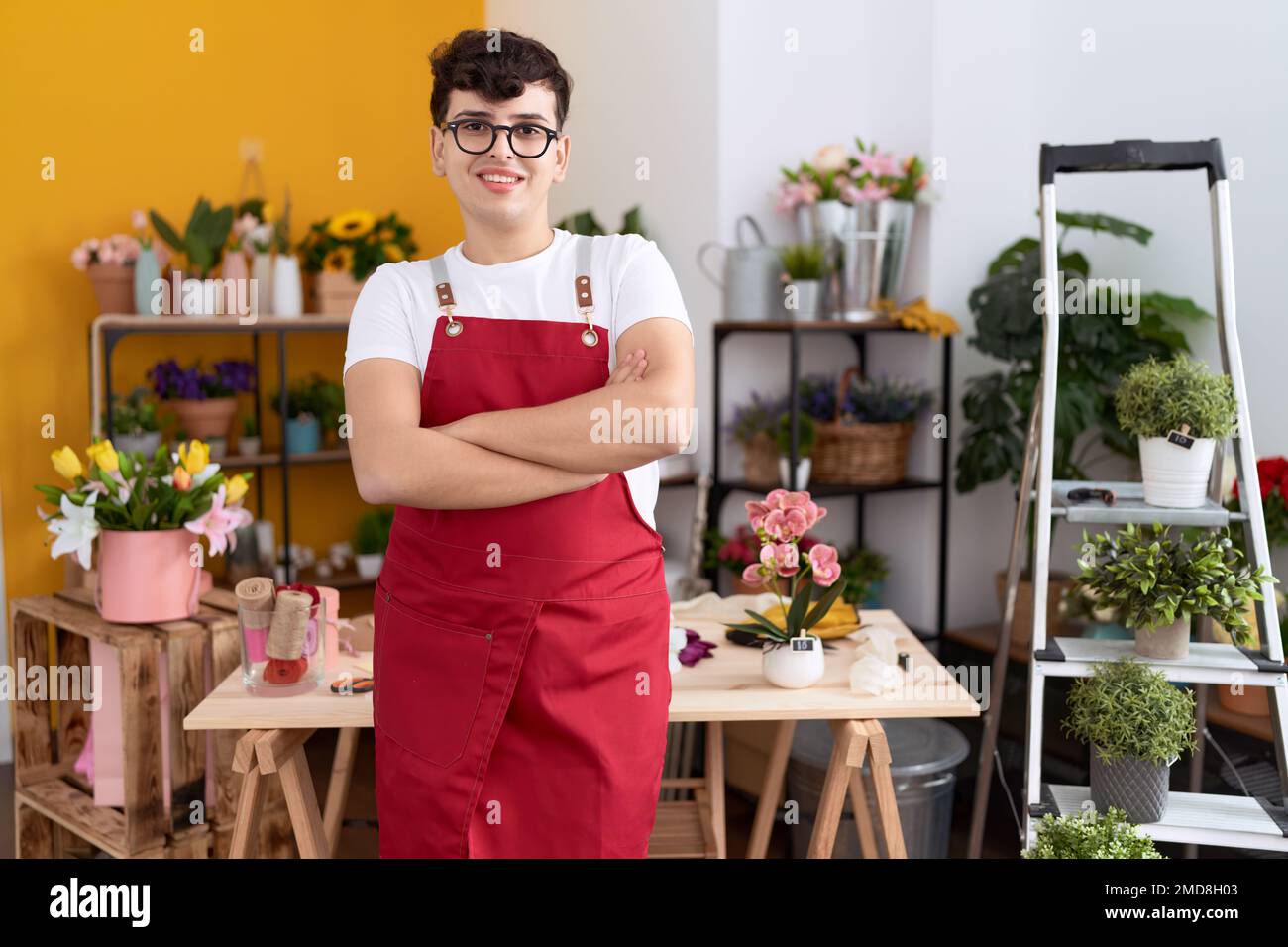 Non binary man florist smiling confident standing with arms crossed ...