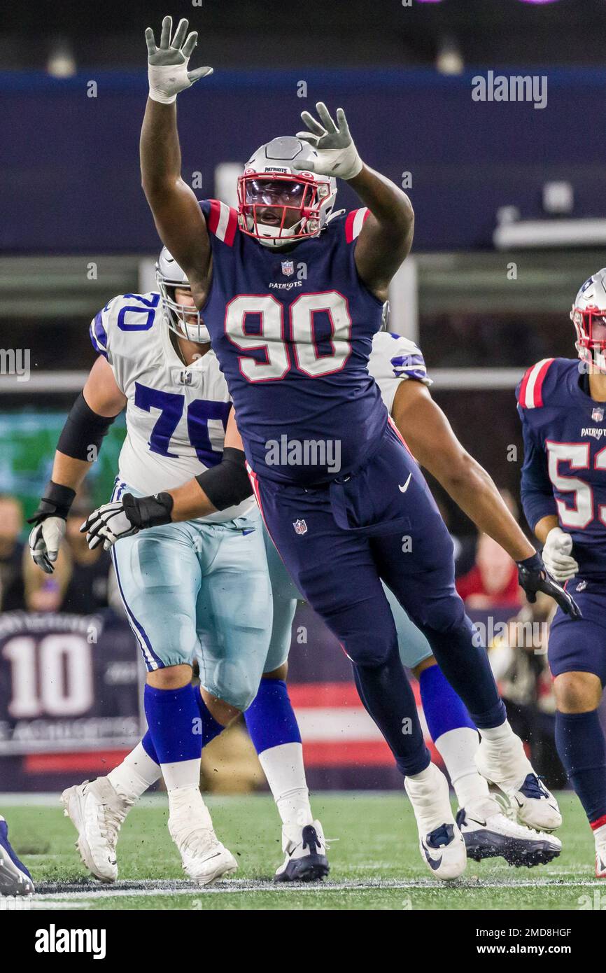 New England Patriots defensive tackle Christian Barmore (90) jumps to ...