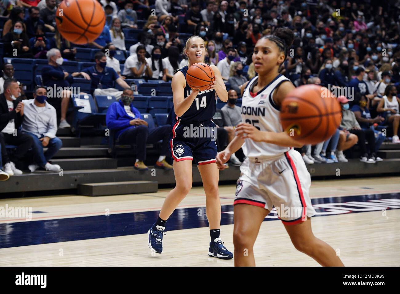 Connecticut's Dorka Juhász shoots as Connecticut's Azzi Fudd chases down balls during UConn's ...
