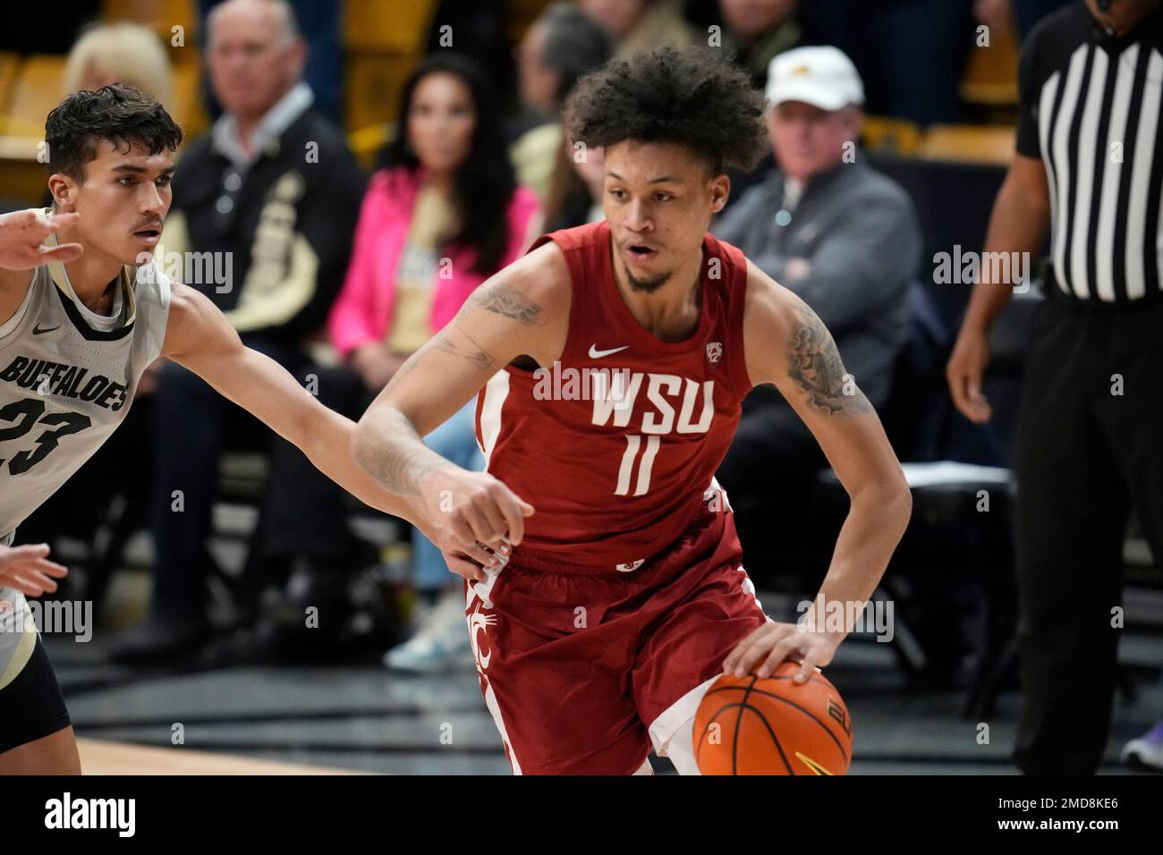 Washington State forward DJ Rodman, right, drives past Colorado forward ...