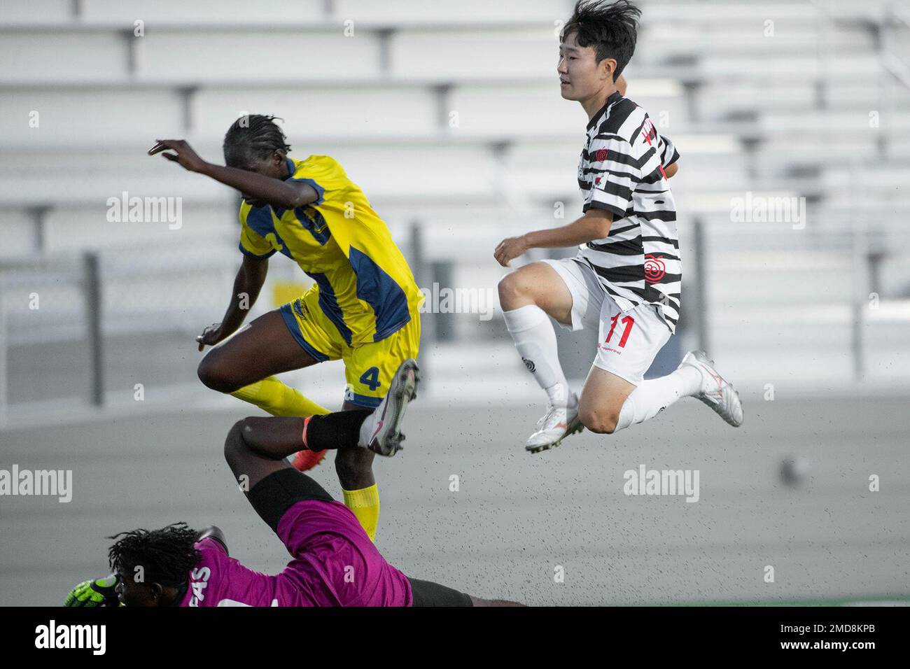 South Korea’s Min Soo Kim leaps over Mali goalkeeper Fatoumata Karentao ...