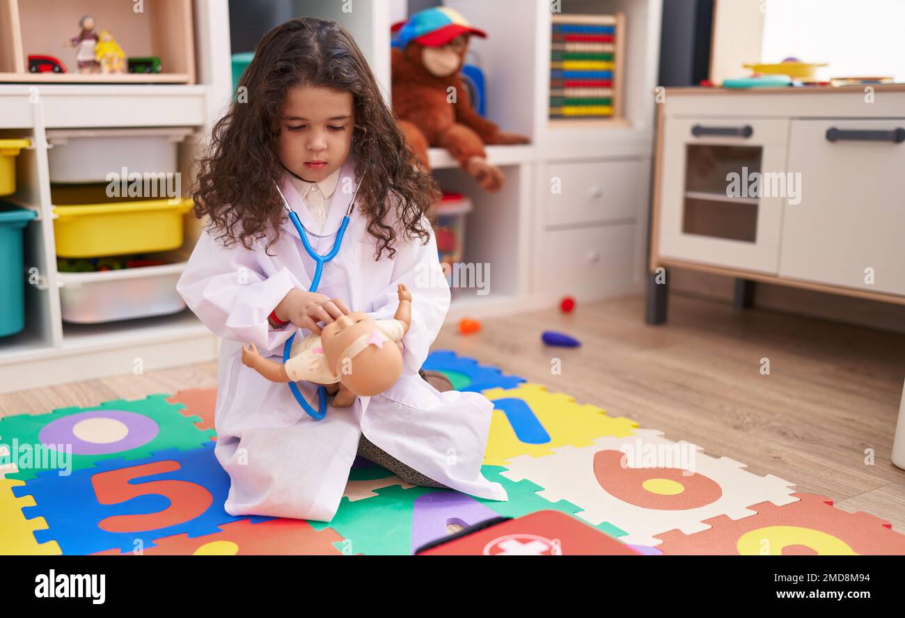Doctor children game kindergarten hi-res stock photography and images ...