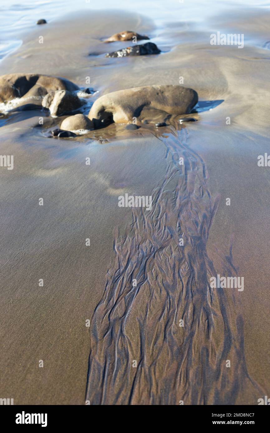 Patterns in sand after a winter storm and king tide, on the central ...