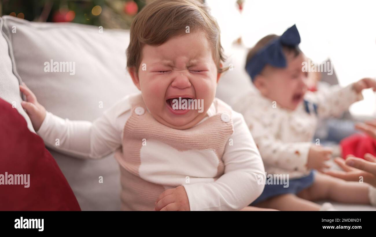 Boy girl sitting crying hi-res stock photography and images - Alamy