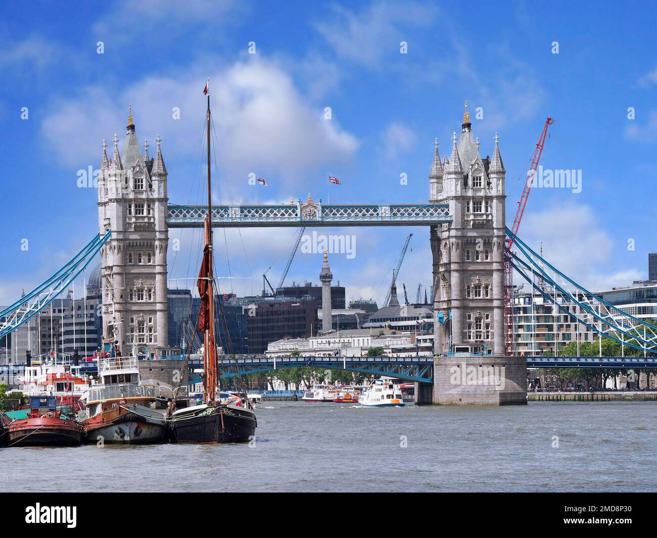 Boats on the Thames River in London beside Tower Bridge Stock Photo - Alamy
