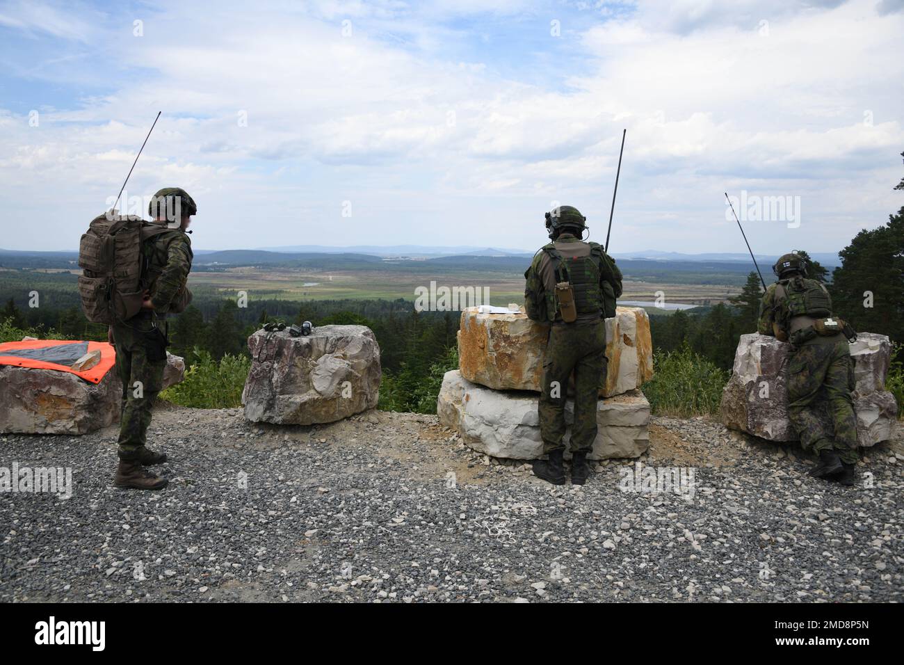 Finnish Joint Tactical Air Control soldiers observe the impact area of ...