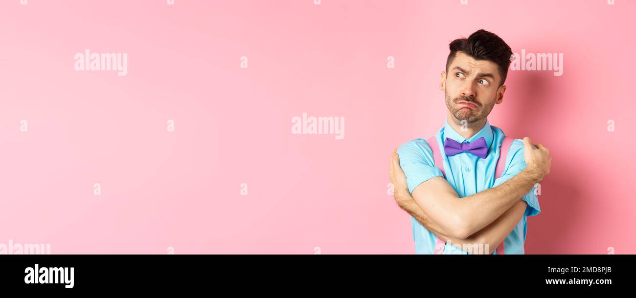 Timid guy feeling offended and lonely, embracing body, comforting ...