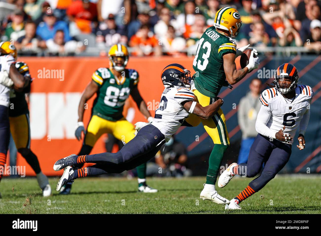 Chicago Bears cornerback Kindle Vildor (22) tackles Green Bay Packers ...