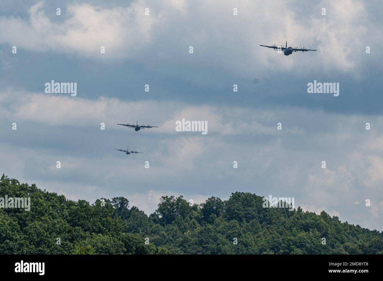 A formation of three C-130J-30 Super Hercules prepares to drop ...