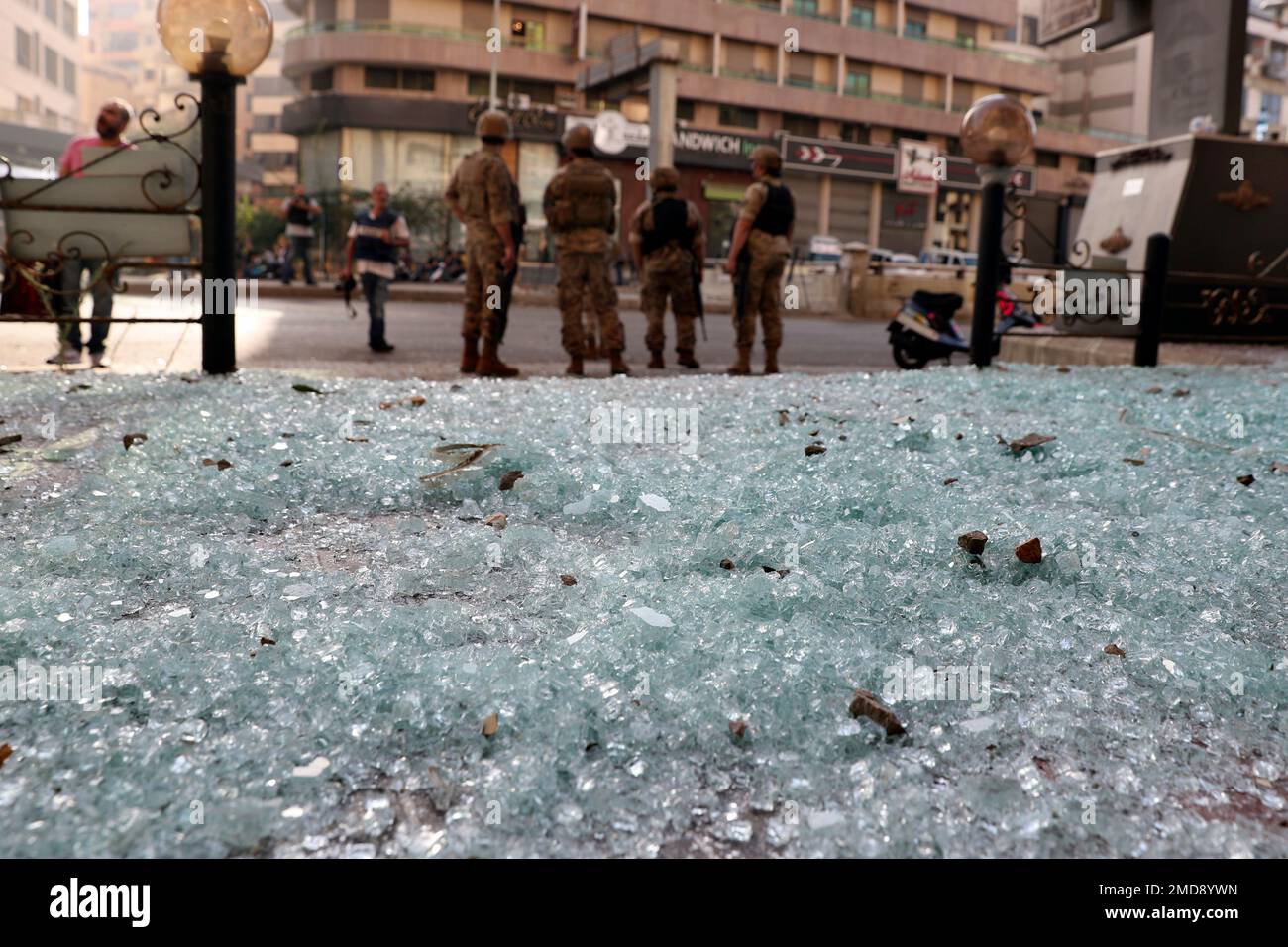 FILE - In this Oct. 14, 2021, file photo, glass from broken windows ...