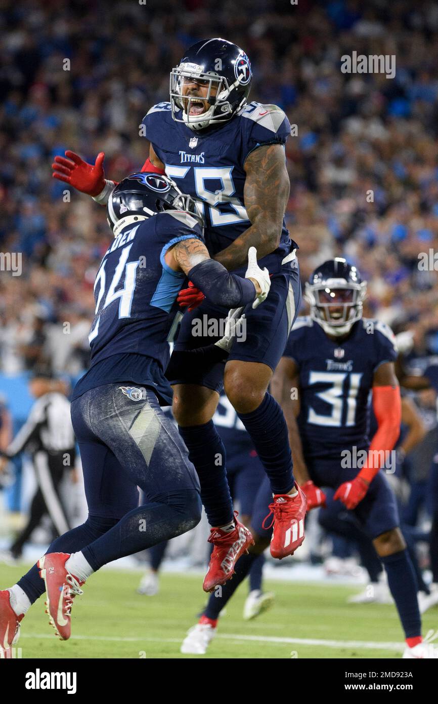 Tennessee Titans outside linebacker Harold Landry (58) and cornerback ...