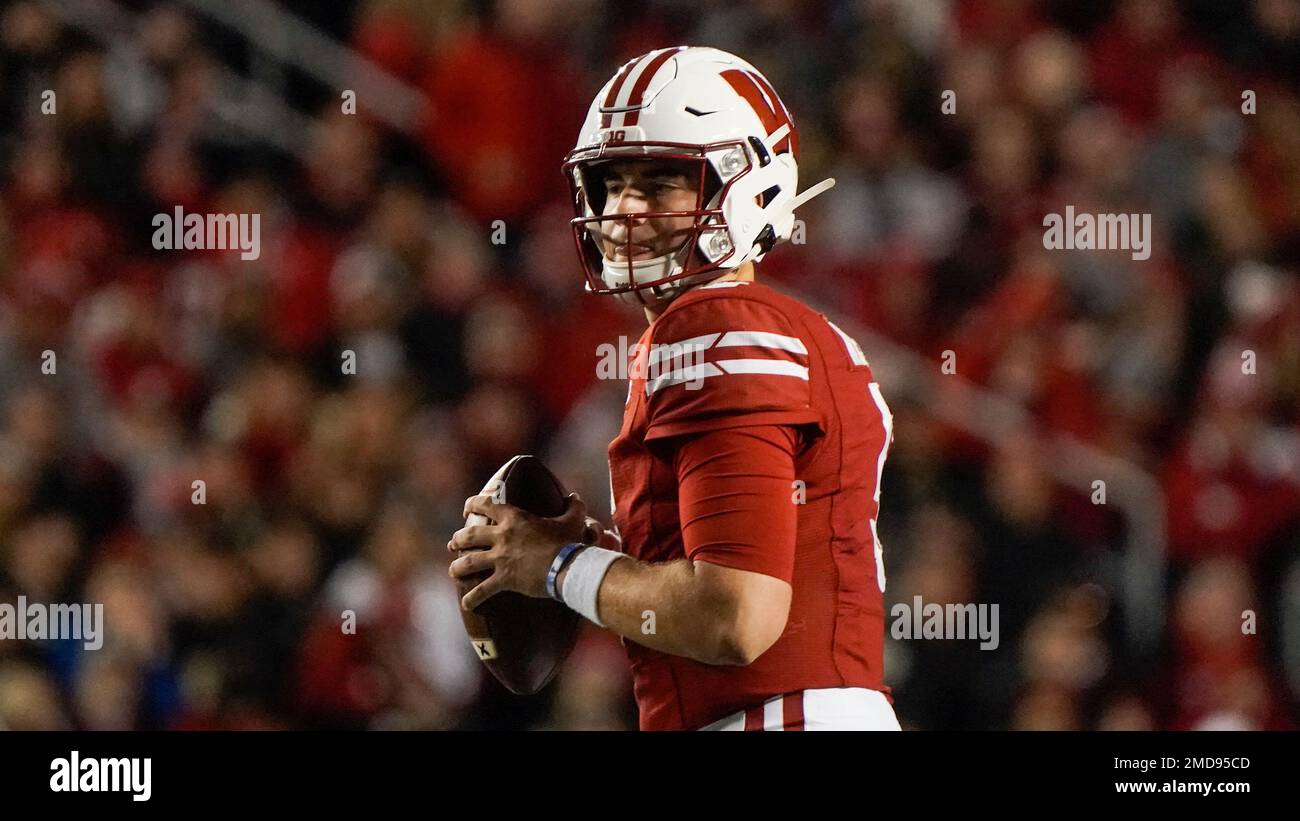 Wisconsin's Graham Mertz looks to pass during the first half of an NCAA ...