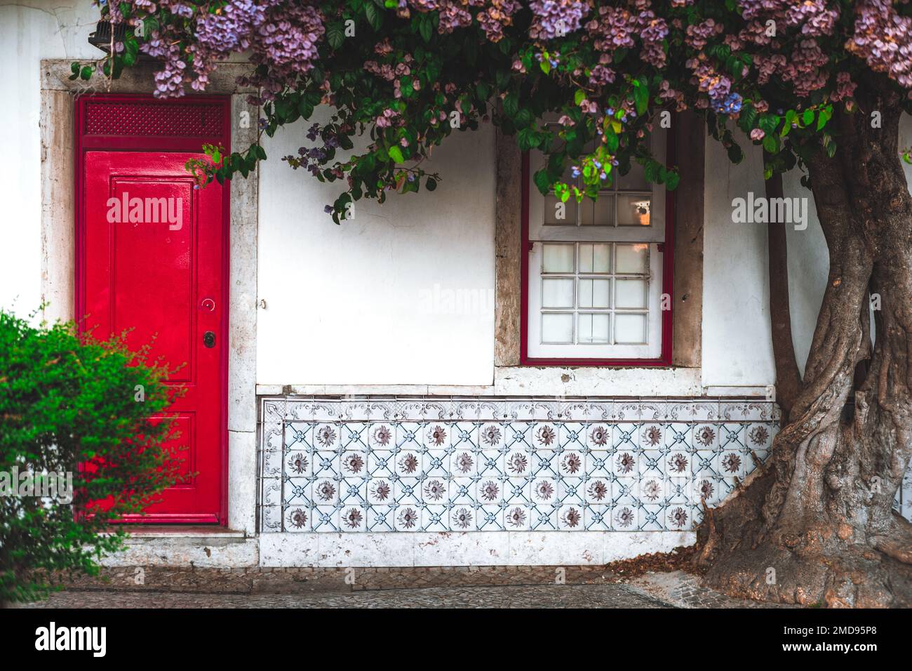 A capture of a house facade with painted tin-glazed ceramic tiles with ...