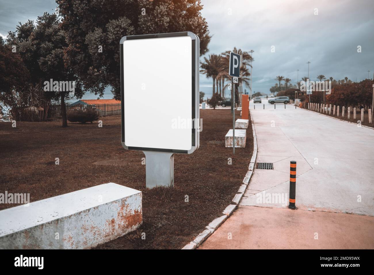 A blank billboard mockup template on the ground soil near the ...