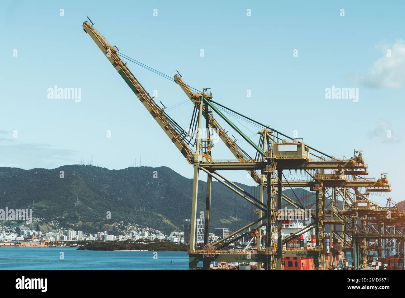 Close-up view of a huge heavy harbor crane in front of the beautiful ...