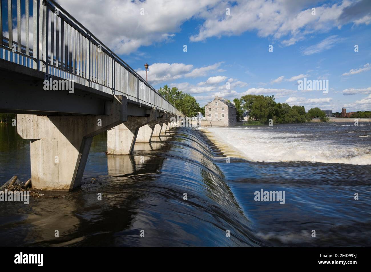 Footbridge and water flow control gate over Des Mille-Iles River and ...