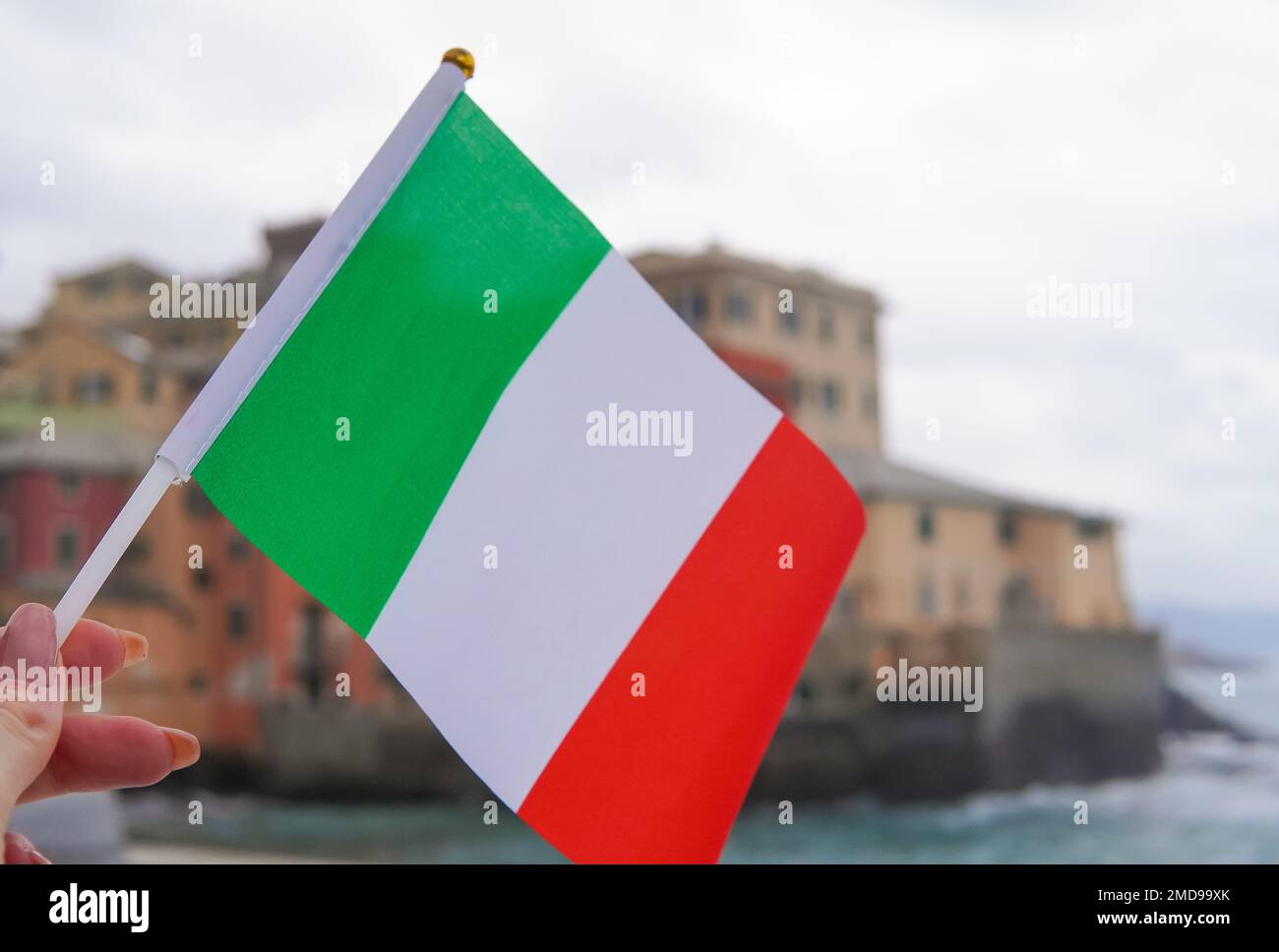 close up of tricolor national flag of Italy on seascape background ...
