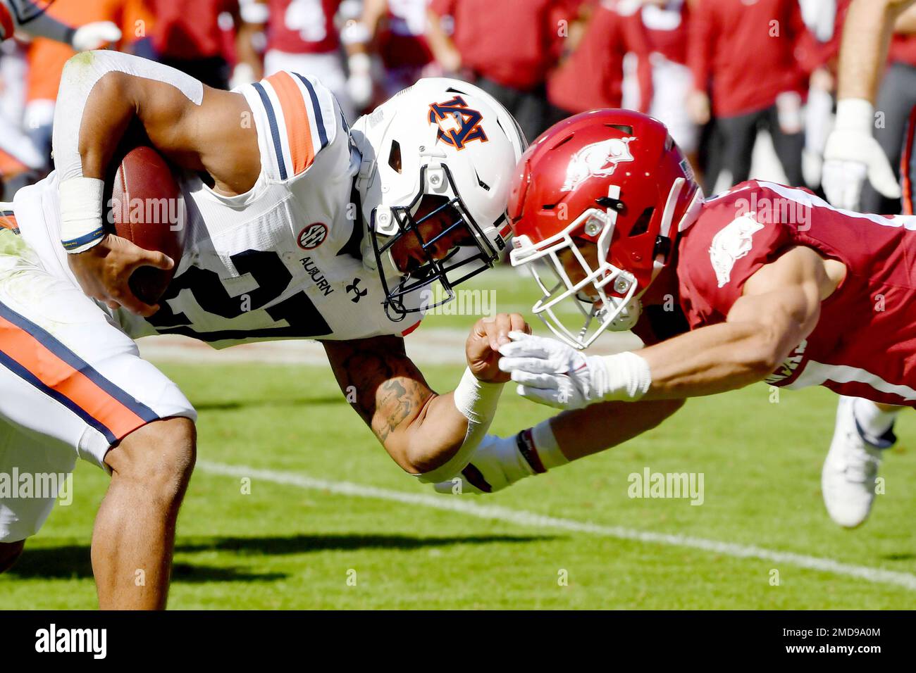 Auburn running back Jarquez Hunter (27) is tackled by Arkansas ...