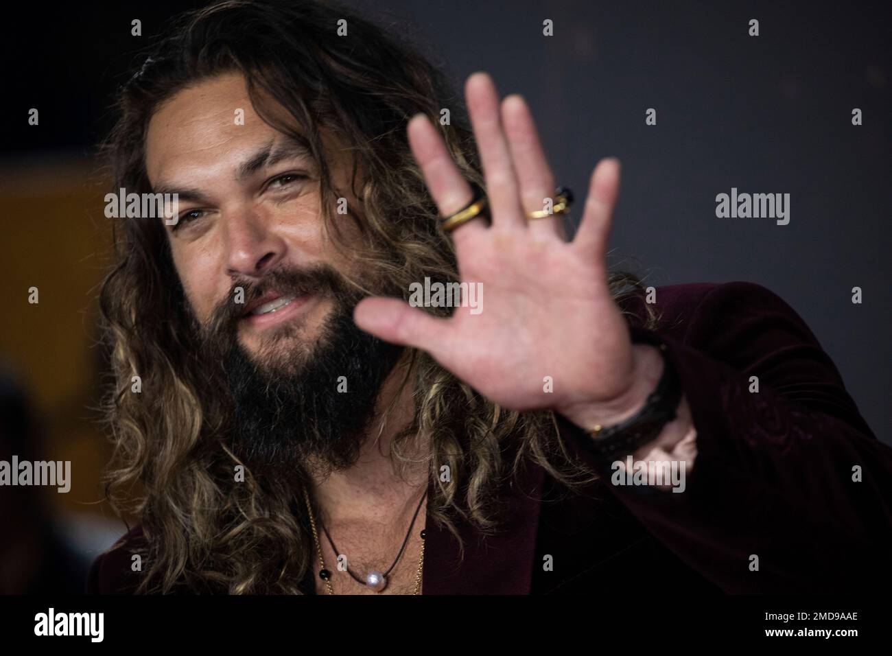 Jason Momoa poses for photographers upon arrival at the premiere of the ...