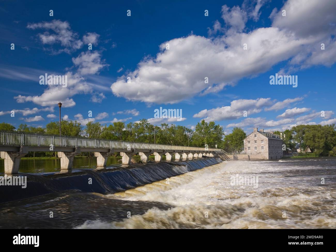 Footbridge and water flow control gate over Des Mille-Iles River and ...
